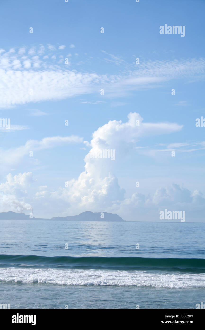 Waves and ocean with cloudscape and blue sky Stock Photo - Alamy