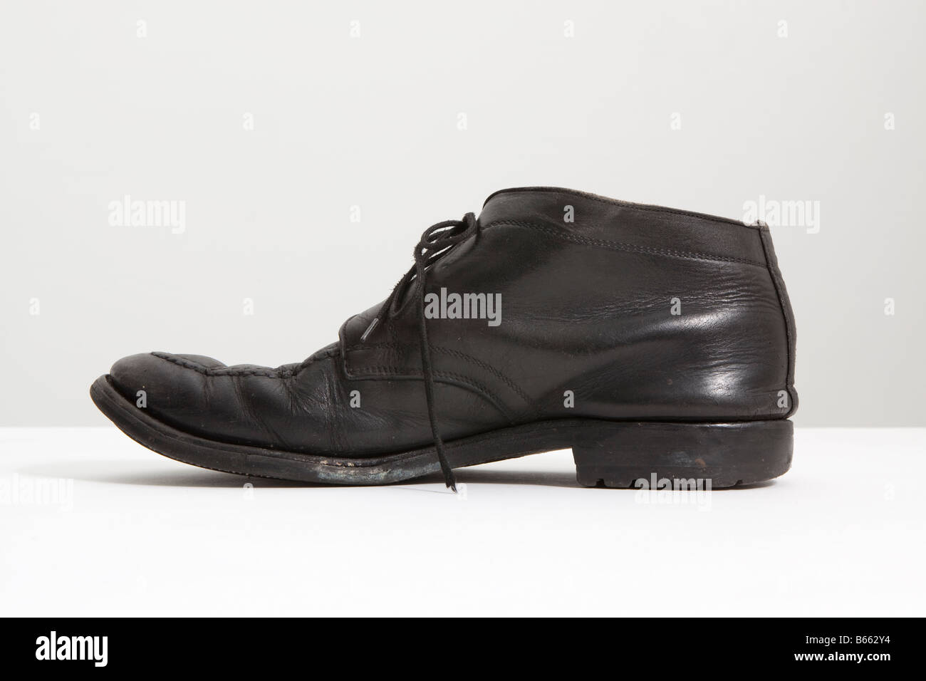 single black leather boot Stock Photo - Alamy