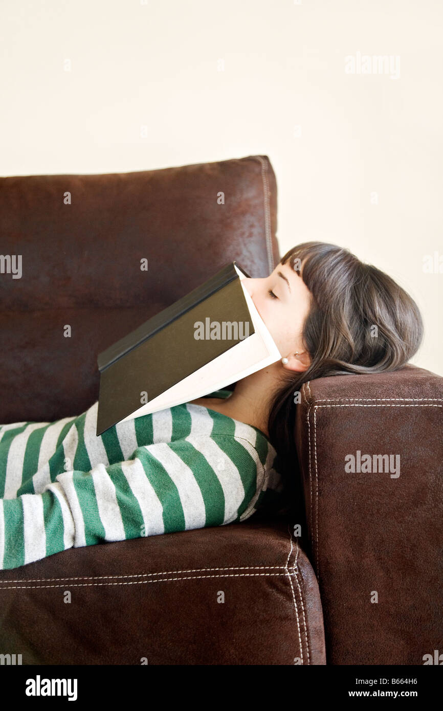 girl woman sleepy reading book Stock Photo - Alamy