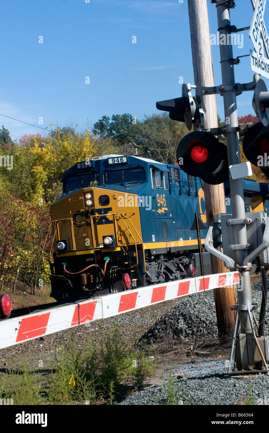 Railroad crossing with red light and stop gate Stock Photo - Alamy
