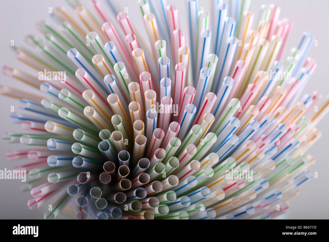 Collection of plastic coloured straws against a white background Stock ...