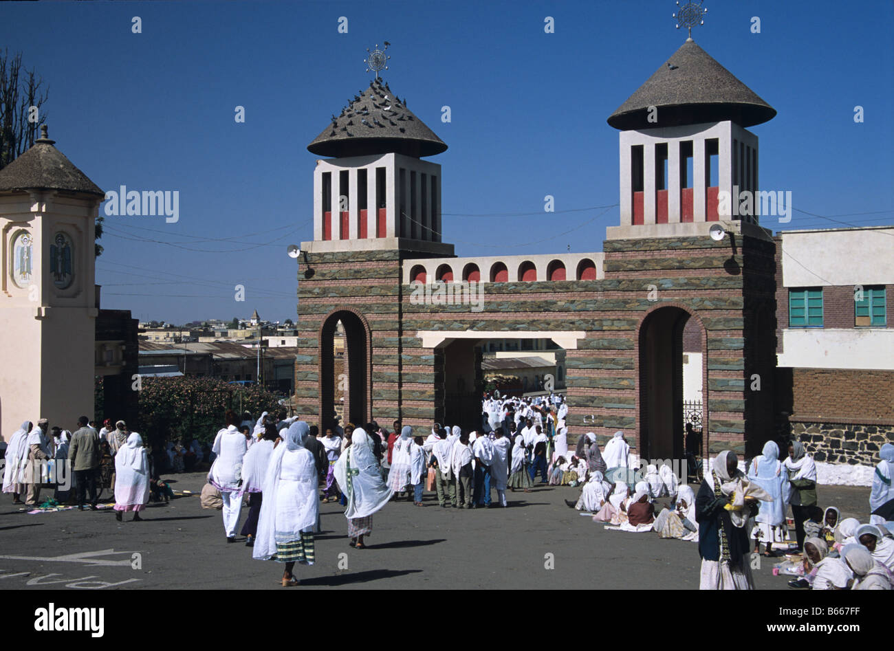 Sunday morning worshippers outside the entrance to the Orthodox Coptic ...