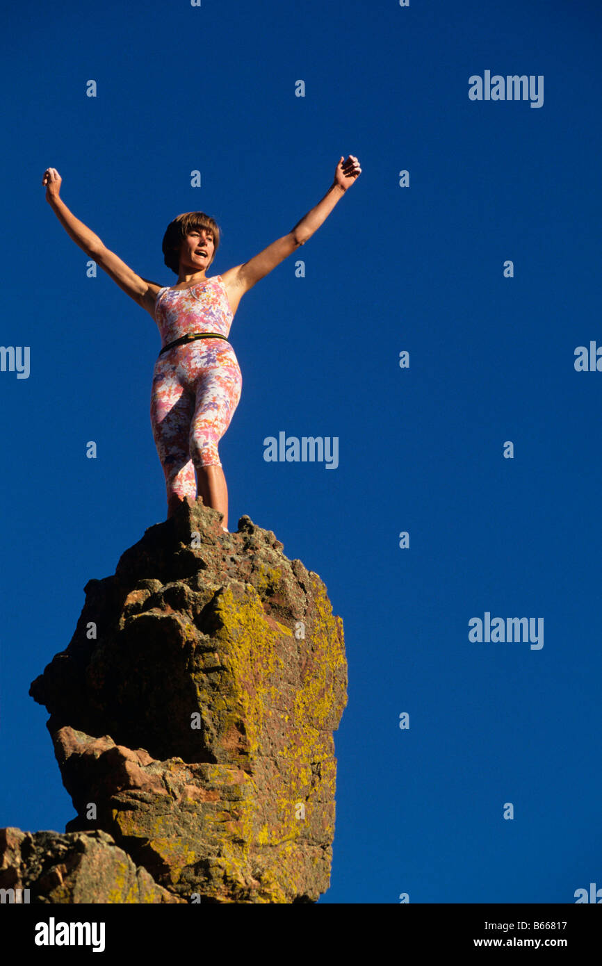 Young woman celebrates completing a successful climb Stock Photo - Alamy