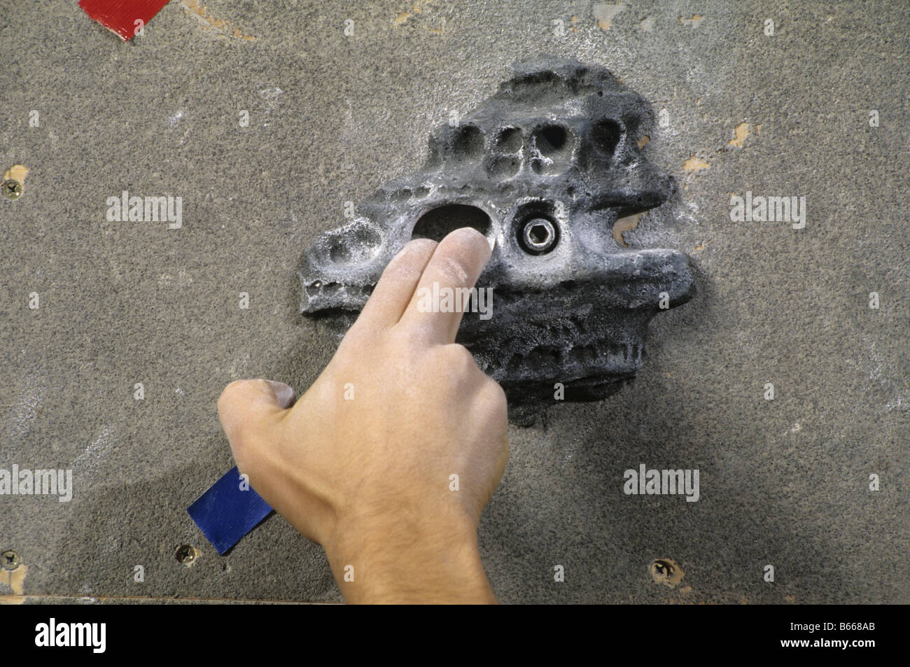 Detail of hand on wall climbing grip Stock Photo - Alamy