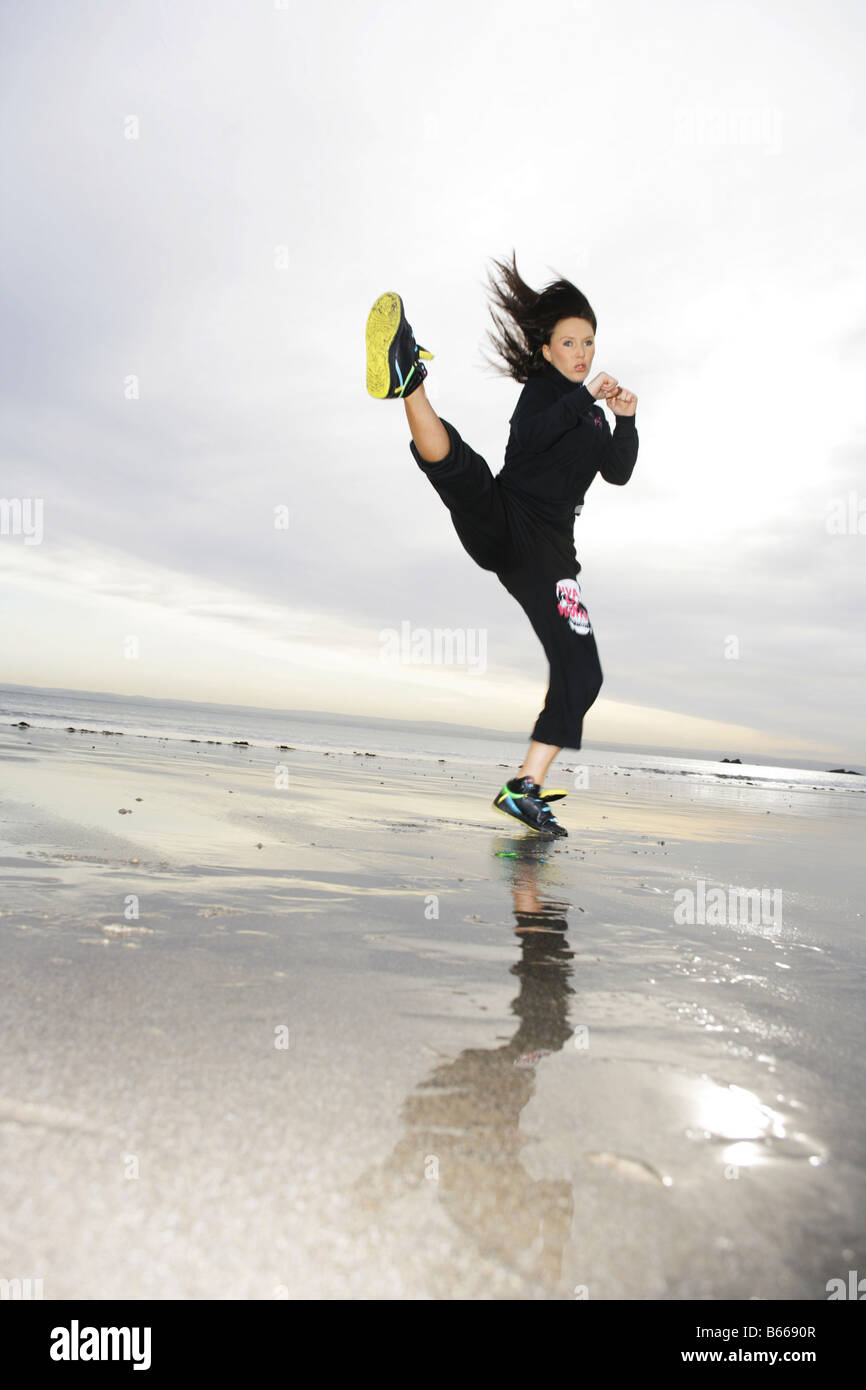 Kicking pose hi-res stock photography and images - Alamy