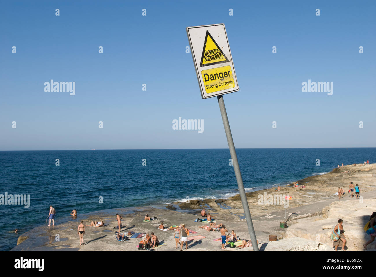 Strong currents warning sign at the beach, Sliema Malta Stock Photo - Alamy