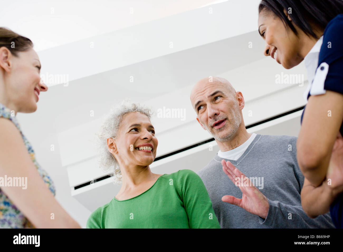 3 business people talking Stock Photo - Alamy