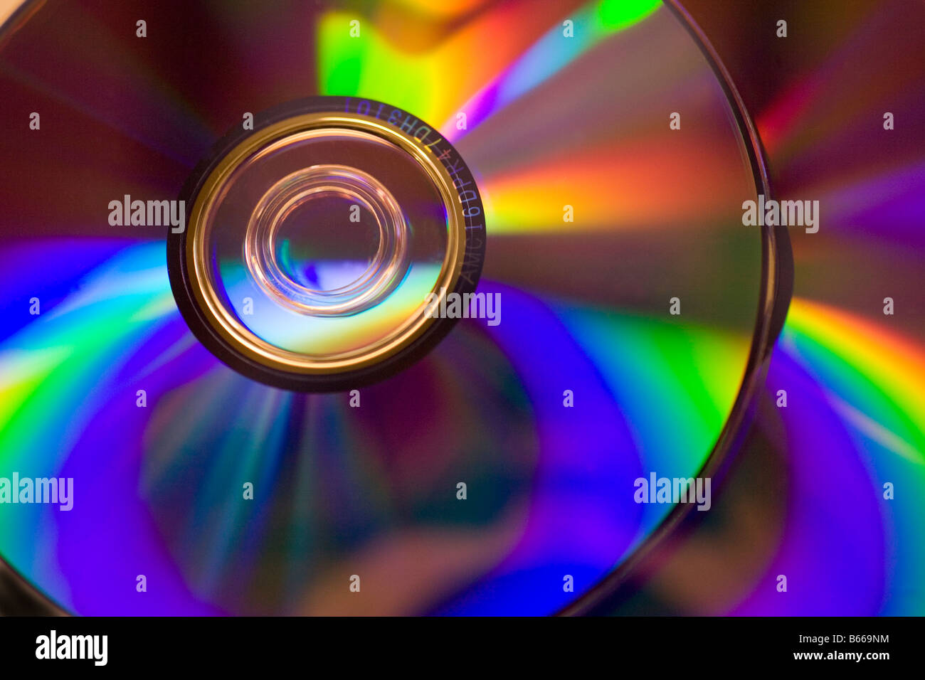 light reflecting from the mirror surface of compact discs Stock Photo ...