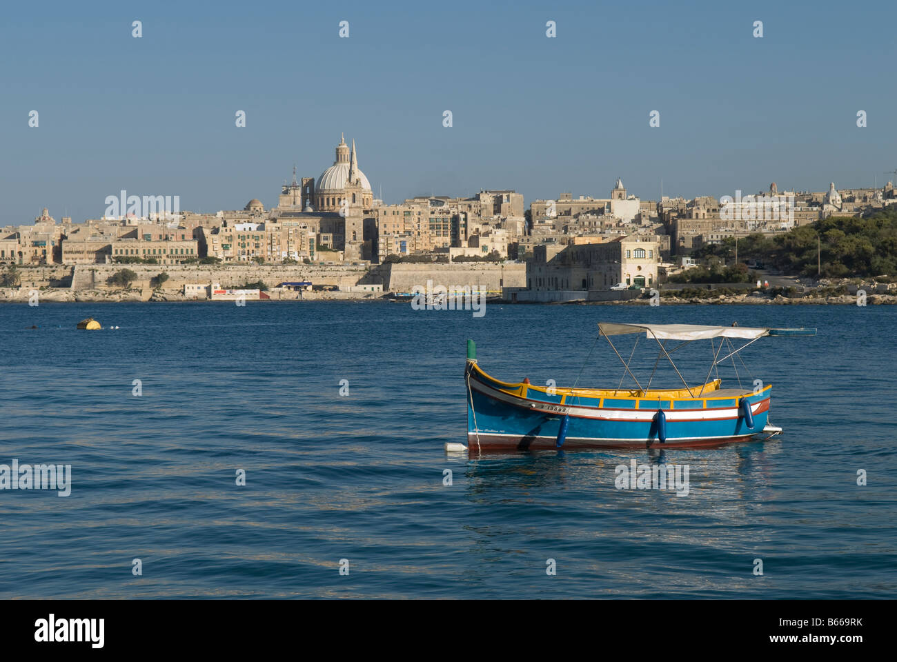 Valletta skyline and fishing boat hi-res stock photography and images ...