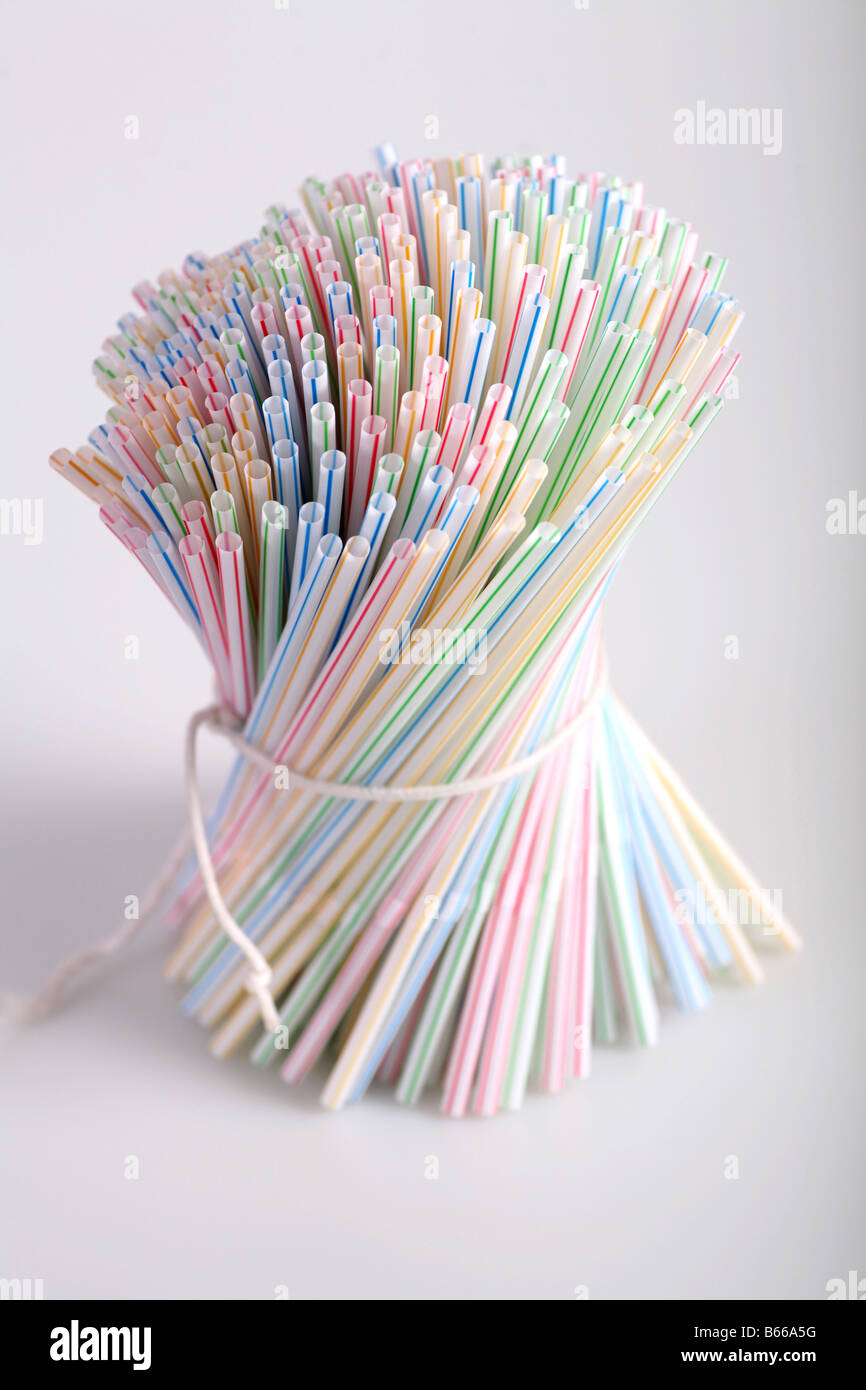 Collection of plastic coloured straws against a white background Stock ...