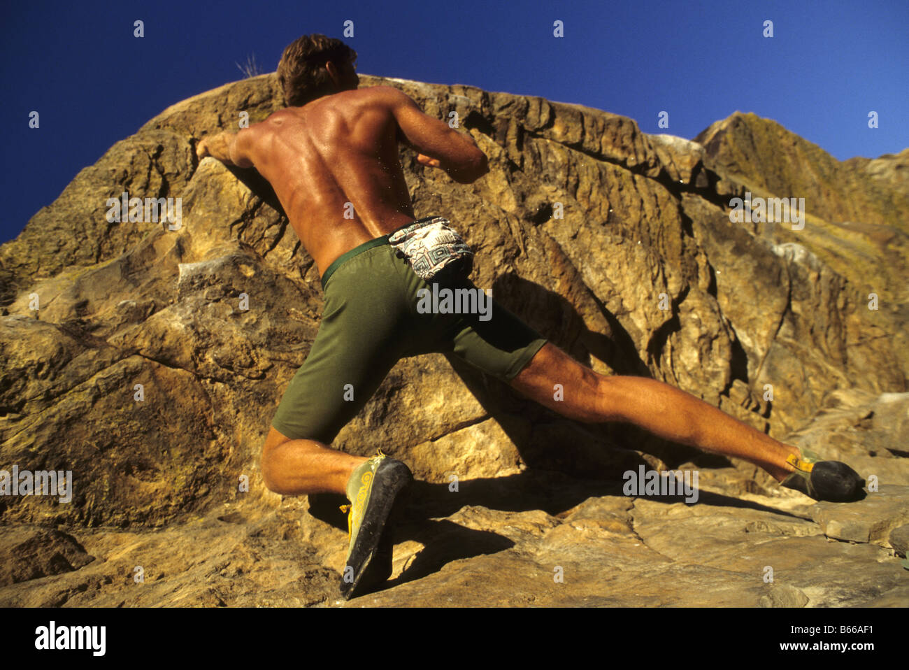 Man rock climbing without equipment Stock Photo - Alamy