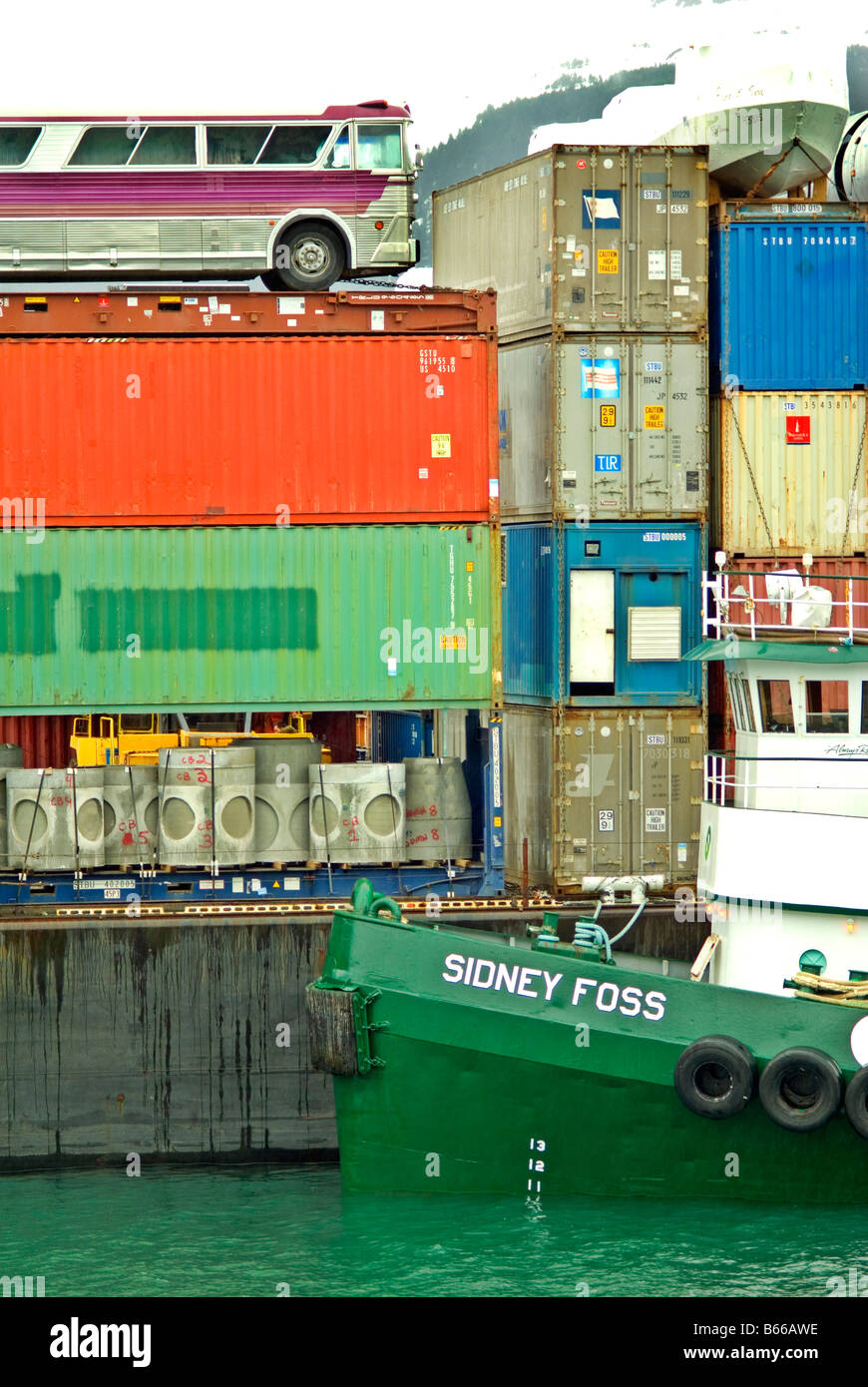 Barge bow in front of boat shipping containers and bus, Alaska Stock ...