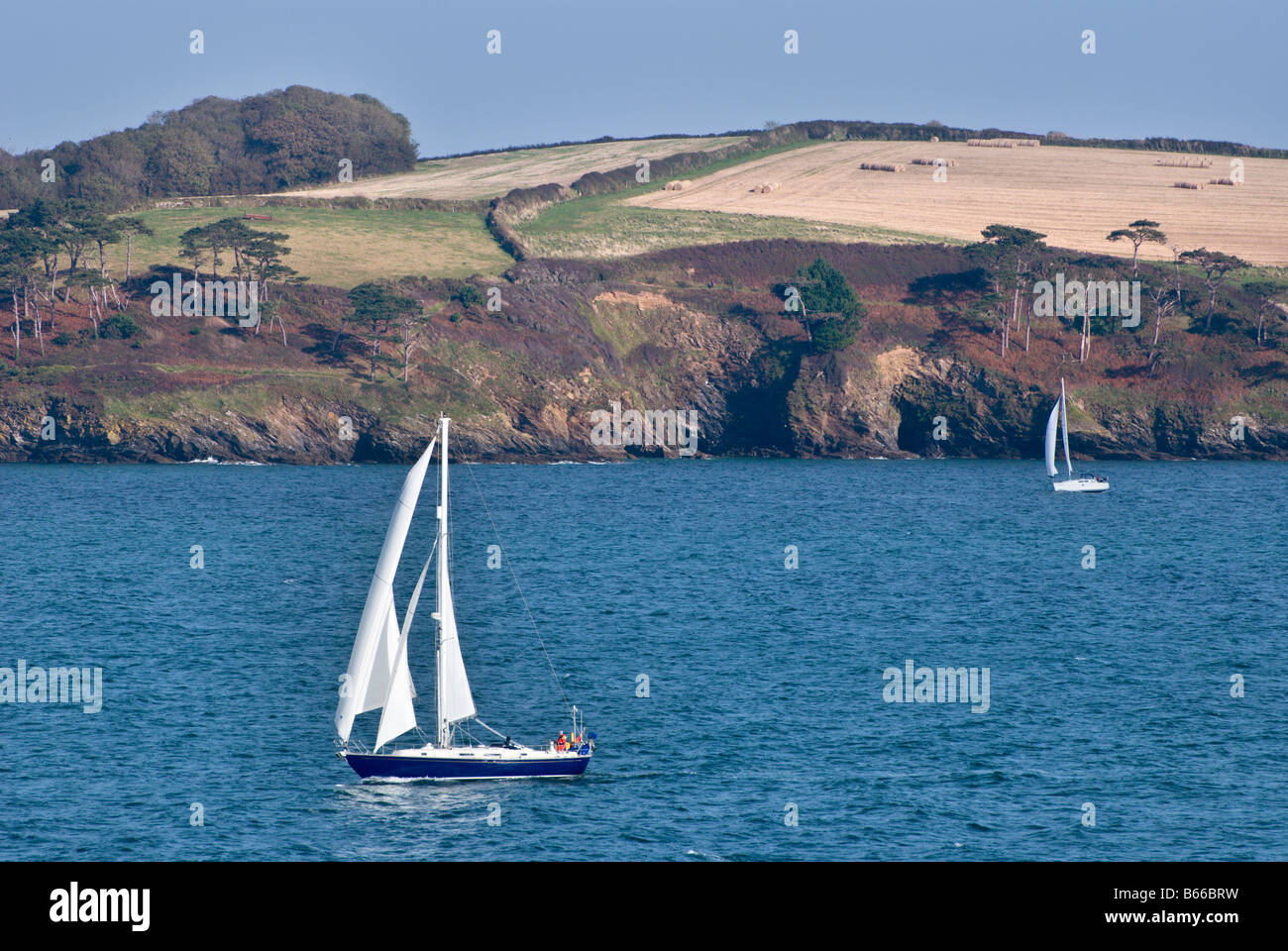 Two yachts sail between Pendennis Point and Zone Point near Falmouth ...