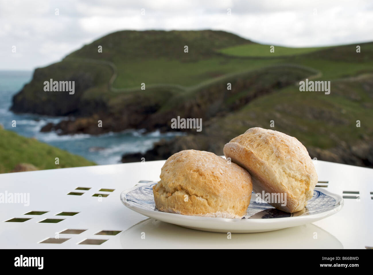 Fresh scones in front of Cornish coastline Stock Photo - Alamy
