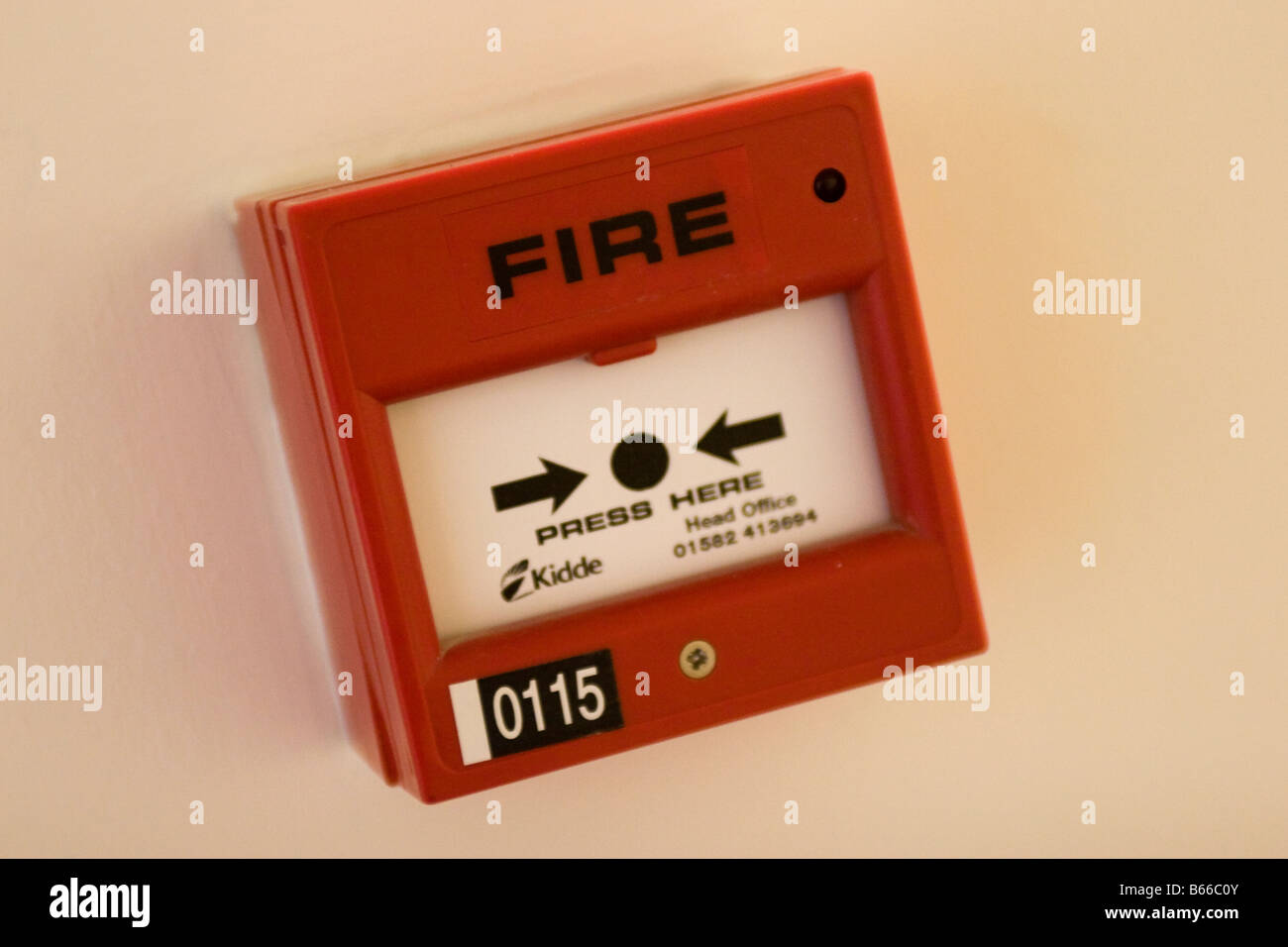 Fire alarm press here box on wall Stock Photo - Alamy