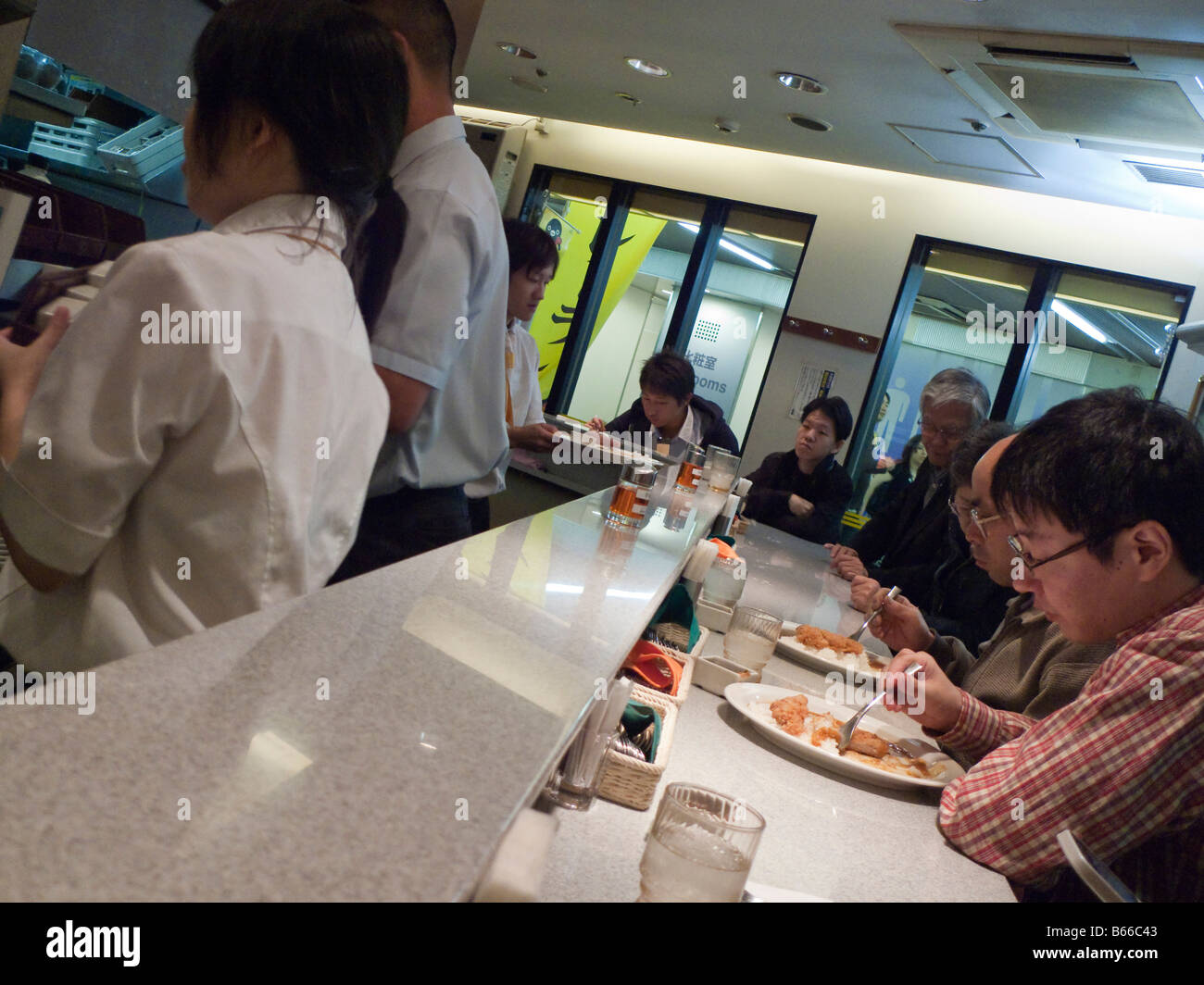 People eating in a curry restaurant in Tokyo station Japan Stock Photo ...