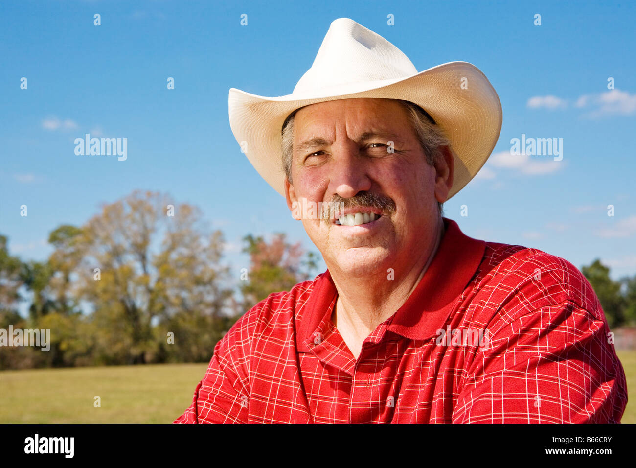 Portrait of a handsome mature cowboy on his ranch Room for text Stock ...