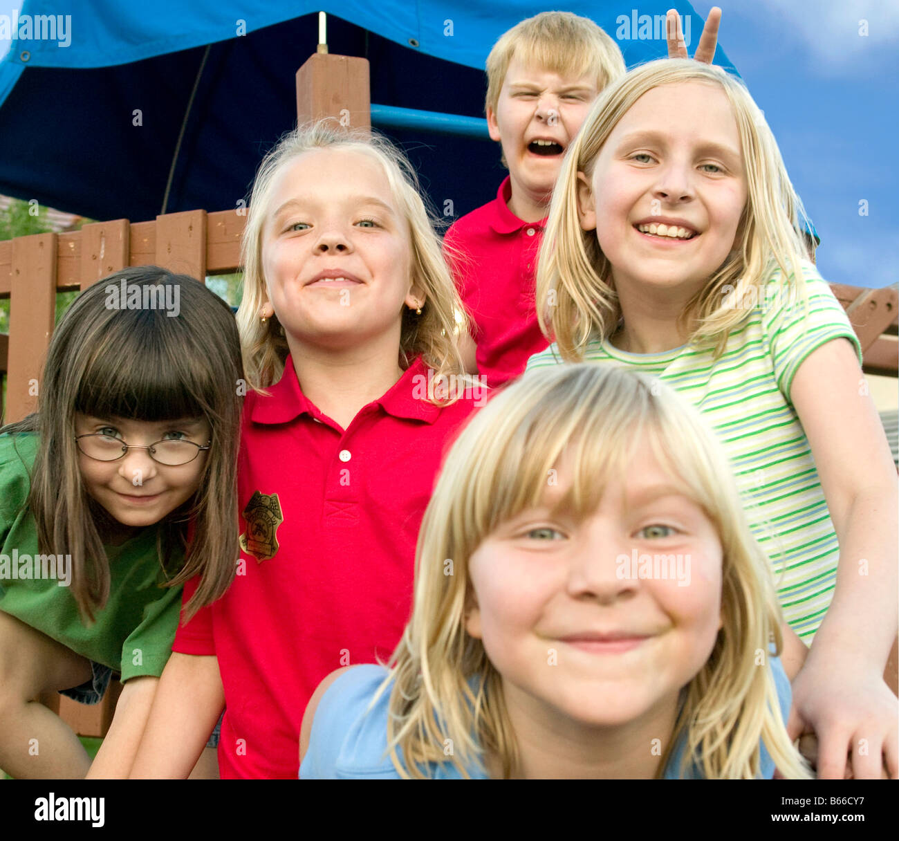Kids having fun at the playground Stock Photo - Alamy