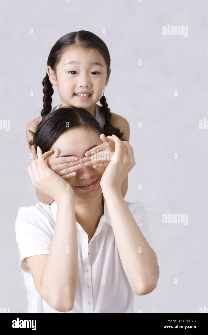 Daughter covering her mother s eyes Stock Photo - Alamy