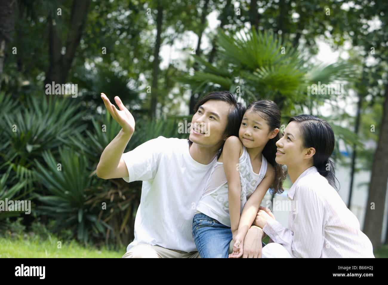 Young family with daughter looking away Stock Photo - Alamy