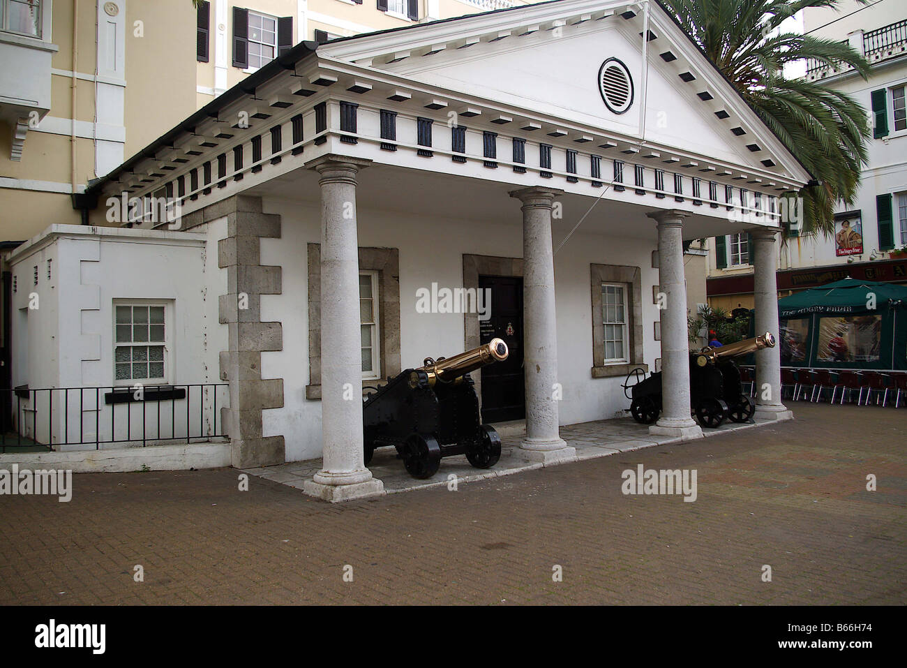 Colonial building with old cannons at Gibraltar Stock Photo - Alamy