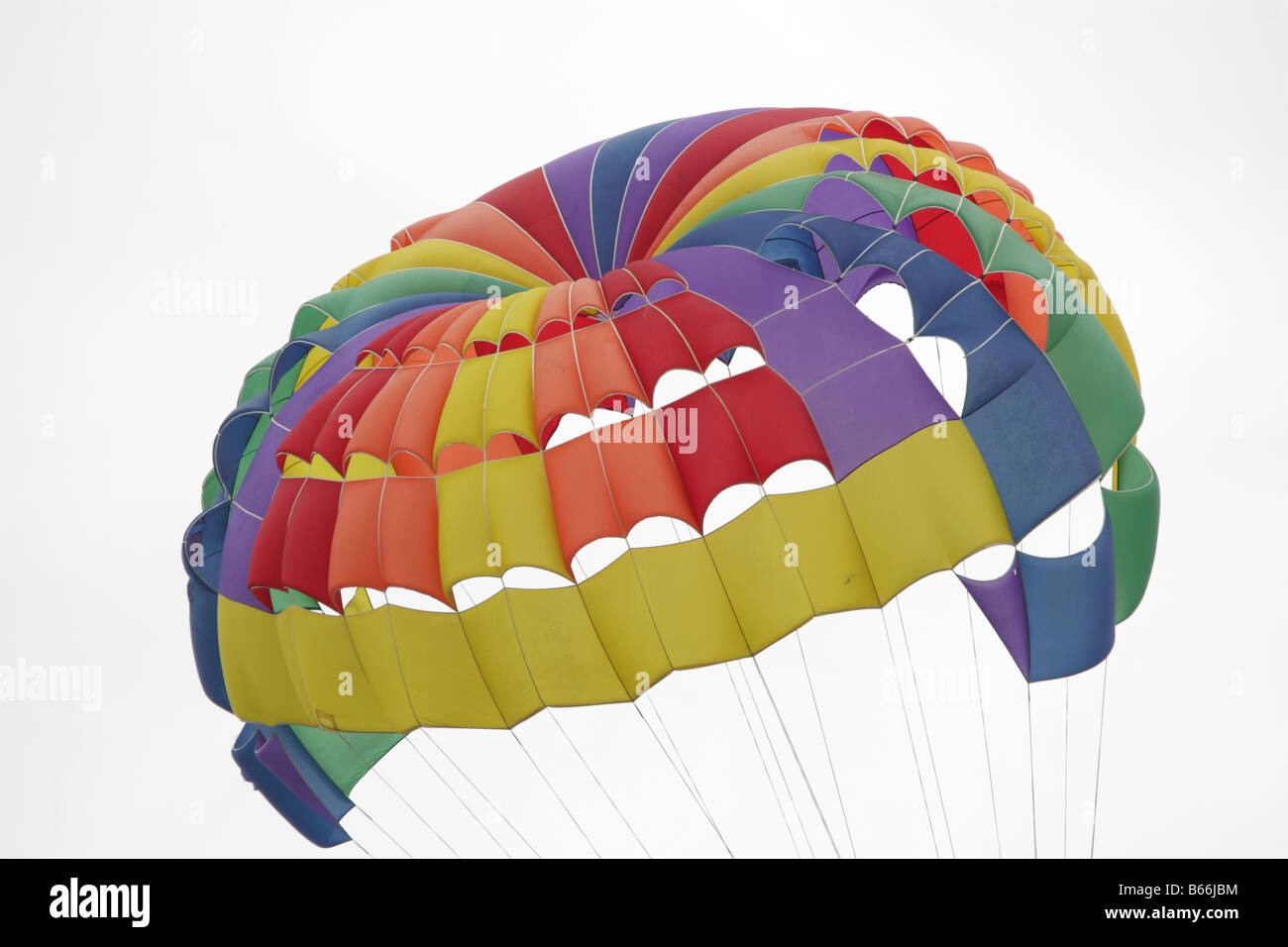 MULTICOLOURED PARACHUTE USED FOR PARASAILING WHITE BACKGROUND ...