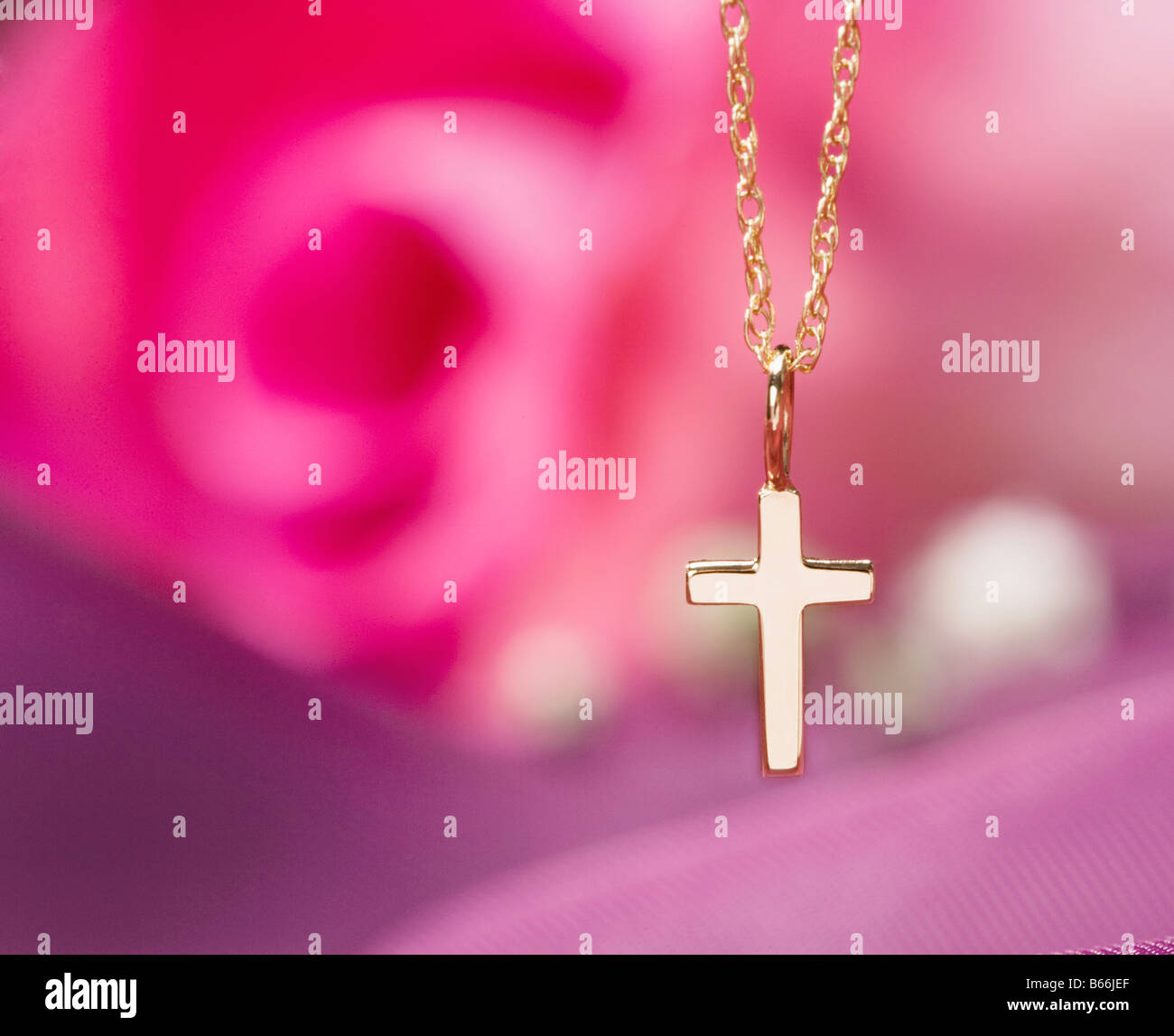 Golden chain with Christian cross Stock Photo - Alamy