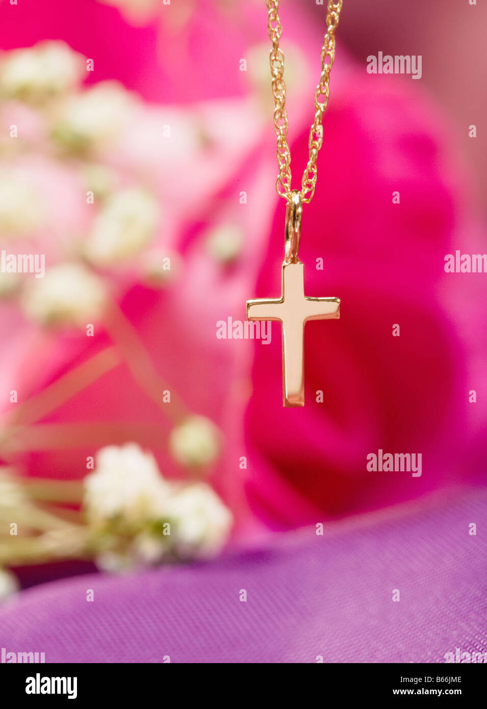 Golden chain with Christian cross Stock Photo - Alamy