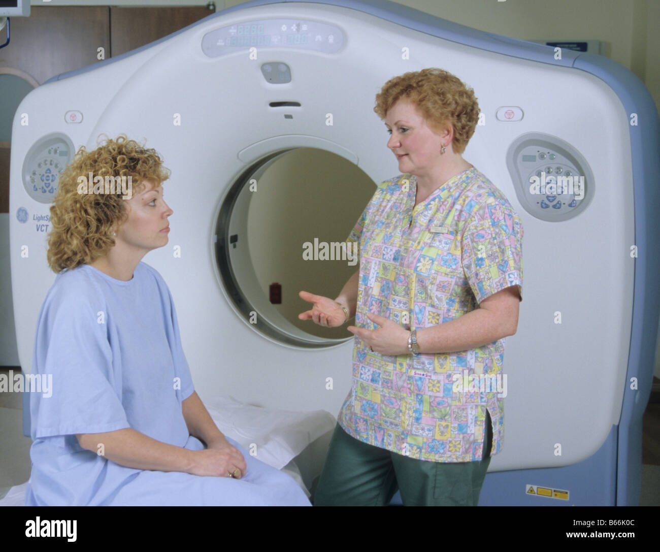 CT scan technologist discussing examination with patient Stock Photo ...