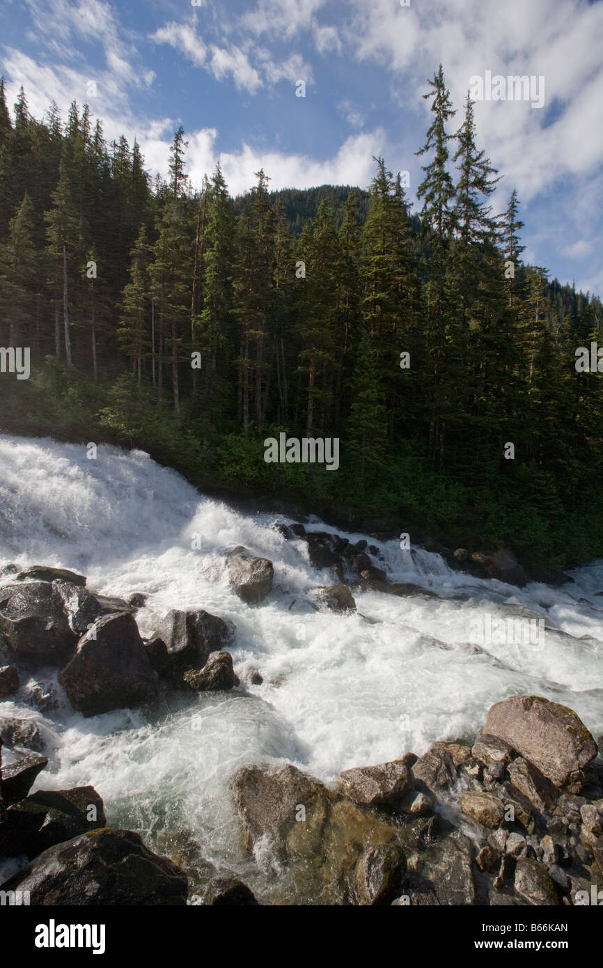 USA Alaska Port Snettisham River swollen with snow melt roars down ...