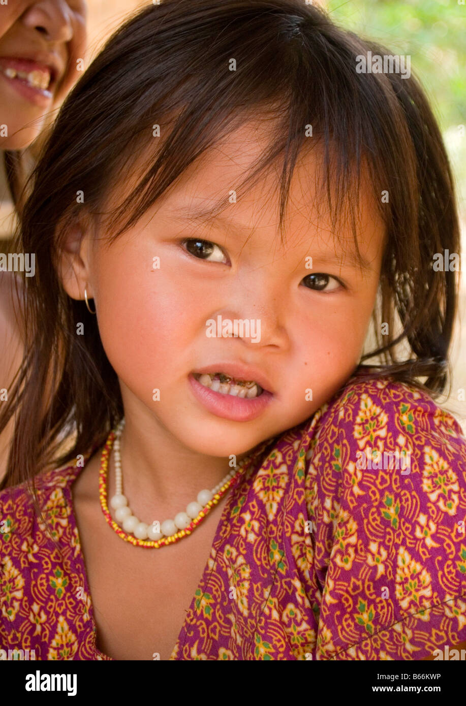 Lao girl with big smile in Muang Ngoi village in northern Laos Stock ...