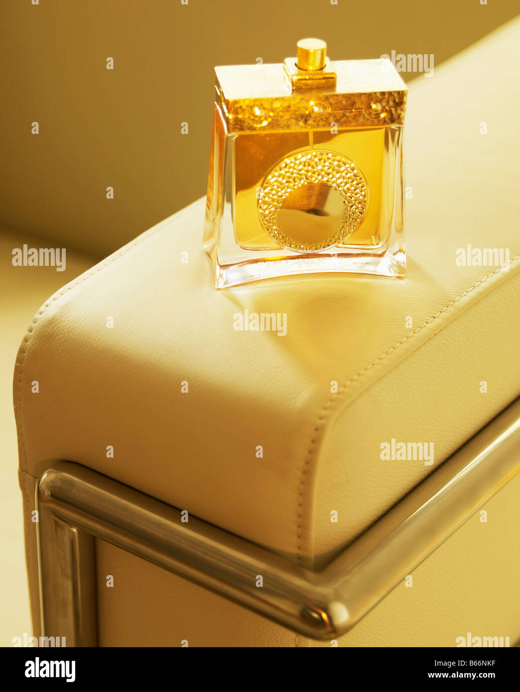 Perfume Bottle on Armchair Stock Photo - Alamy