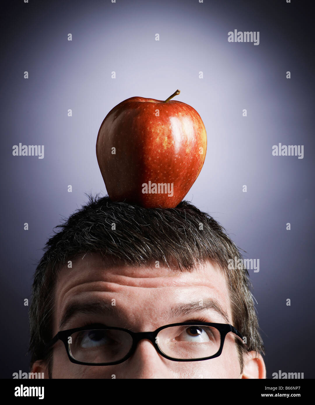 Apple on Mid-Adult Man's Head Stock Photo - Alamy