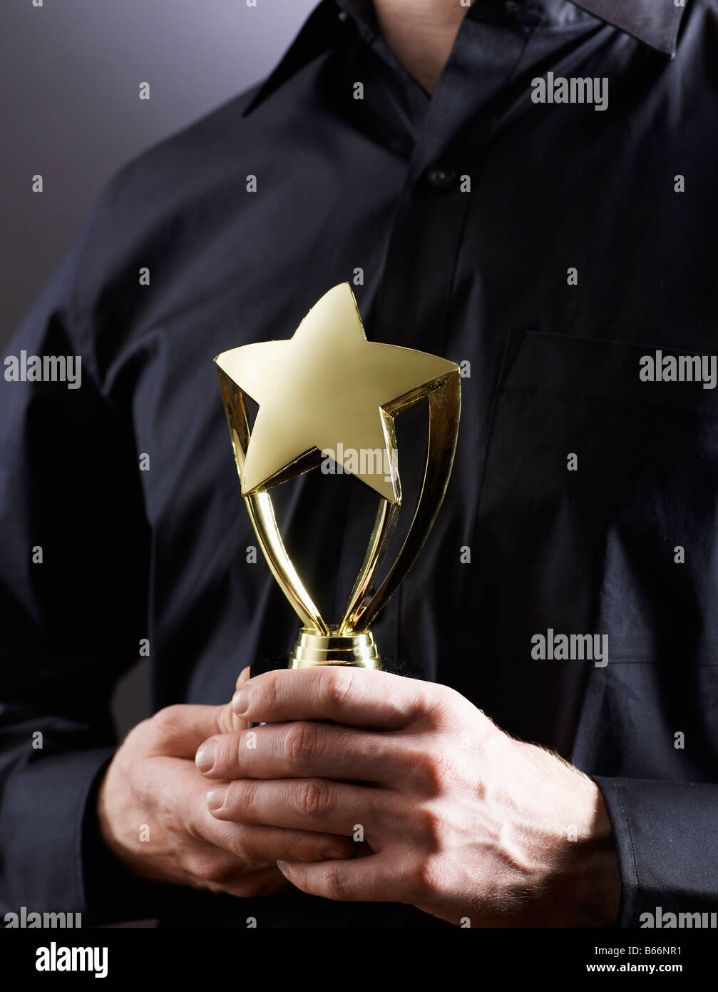 Person Holding Trophy Stock Photo - Alamy