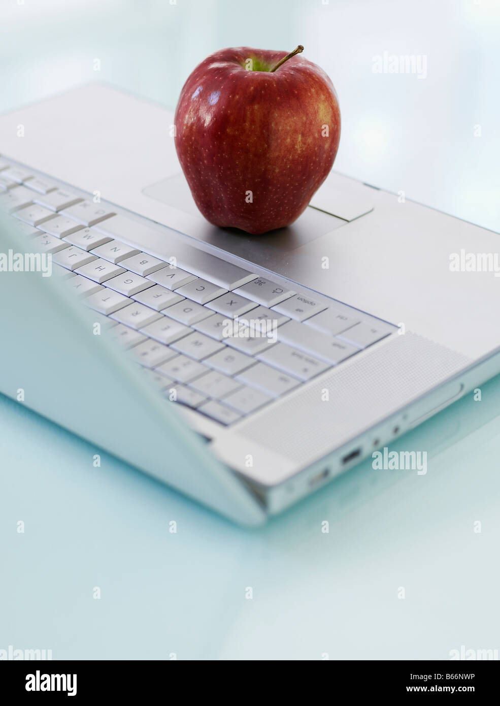 Apple on Laptop Stock Photo - Alamy
