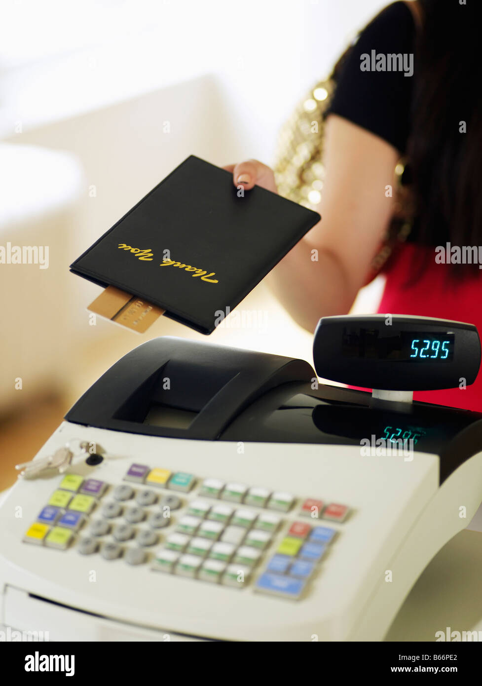 Young Woman Paying for Restaurant Bill Stock Photo - Alamy