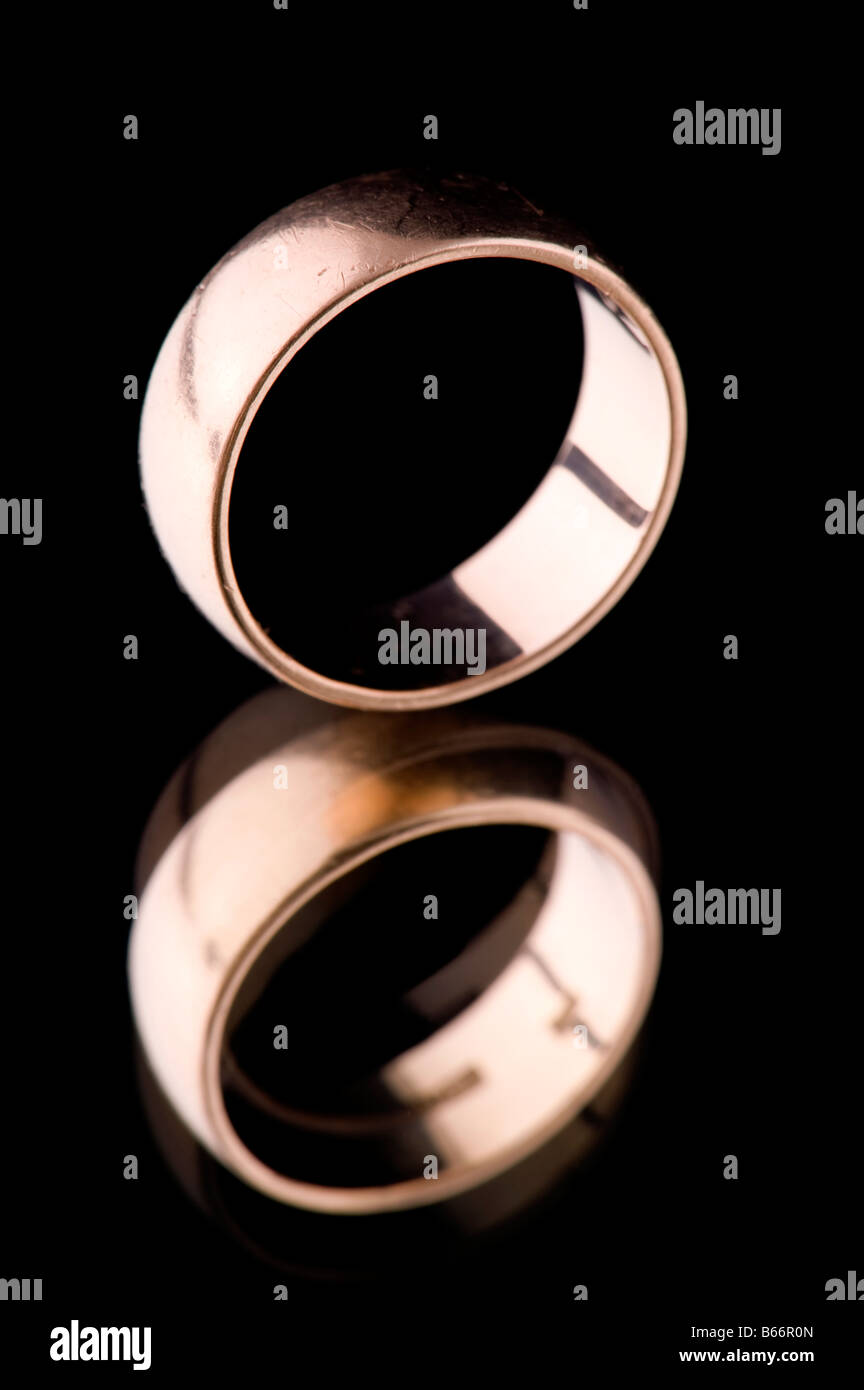 object on black Golden ring closeup Stock Photo - Alamy