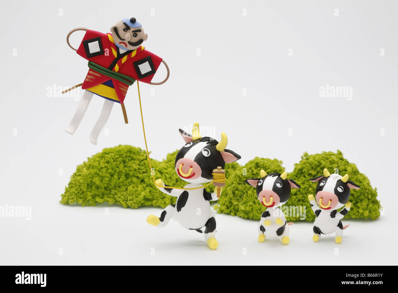 Three Cows Flying Kite Stock Photo - Alamy