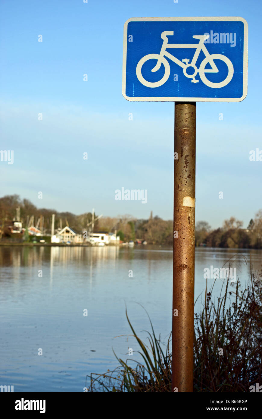 blue and white cycle path sign beside the river thames in kingston upon ...