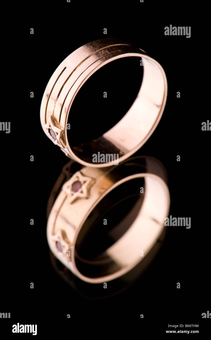 object on black Golden ring closeup Stock Photo - Alamy