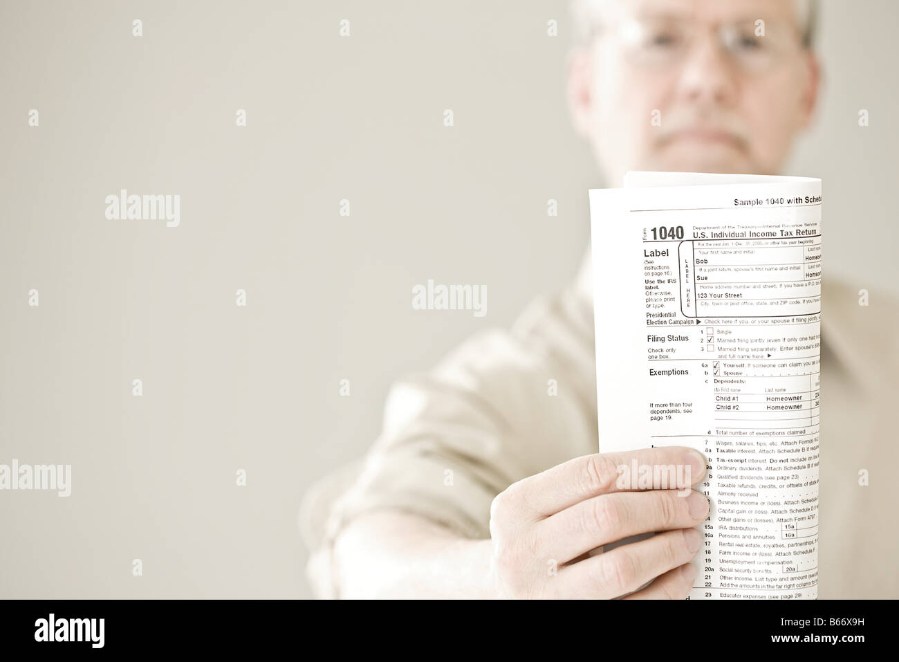 A man holding a document Stock Photo - Alamy