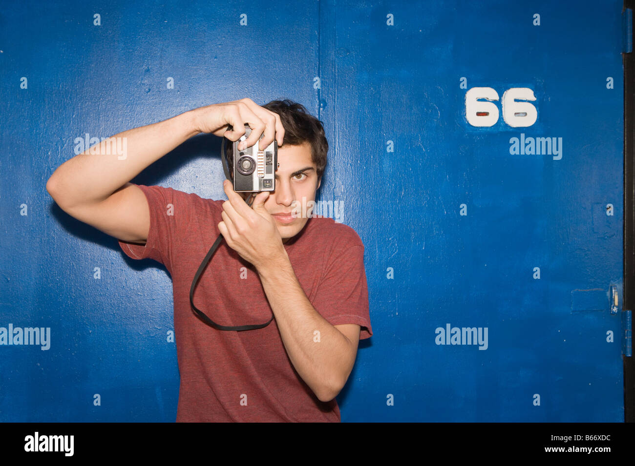 A young man using a camera Stock Photo - Alamy