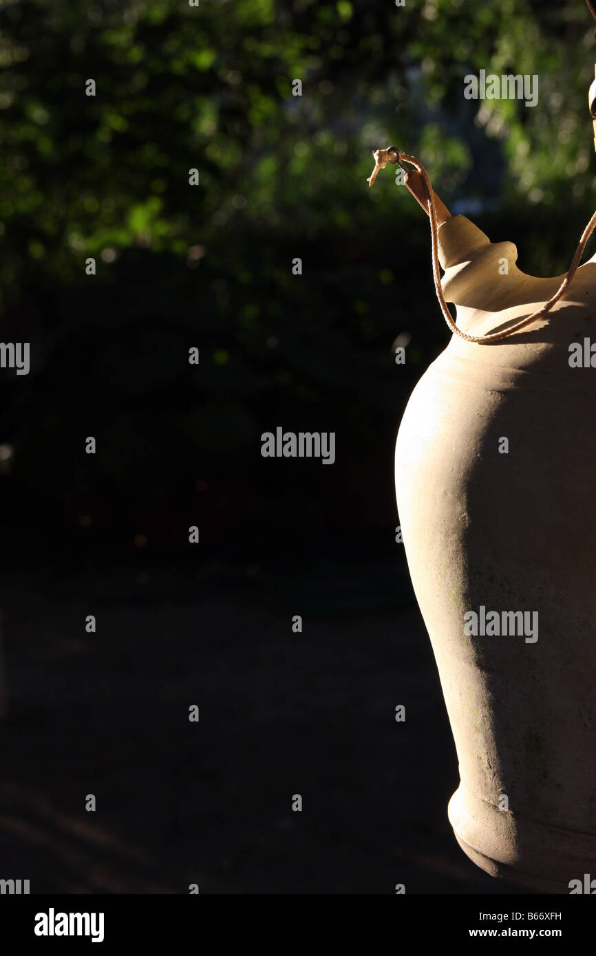 Sunlit Spanish "botijo" (earthenware drinking jug Stock Photo - Alamy