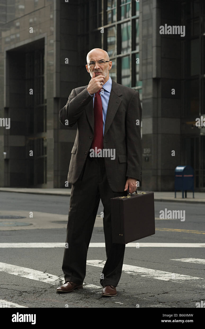 Confused looking businessman Stock Photo - Alamy