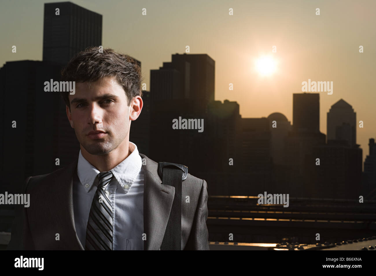 Businessman at sunset Stock Photo - Alamy