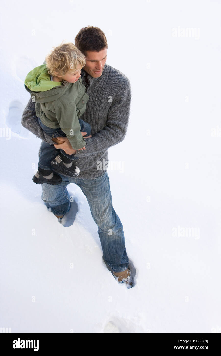 Father and son in snow Stock Photo - Alamy