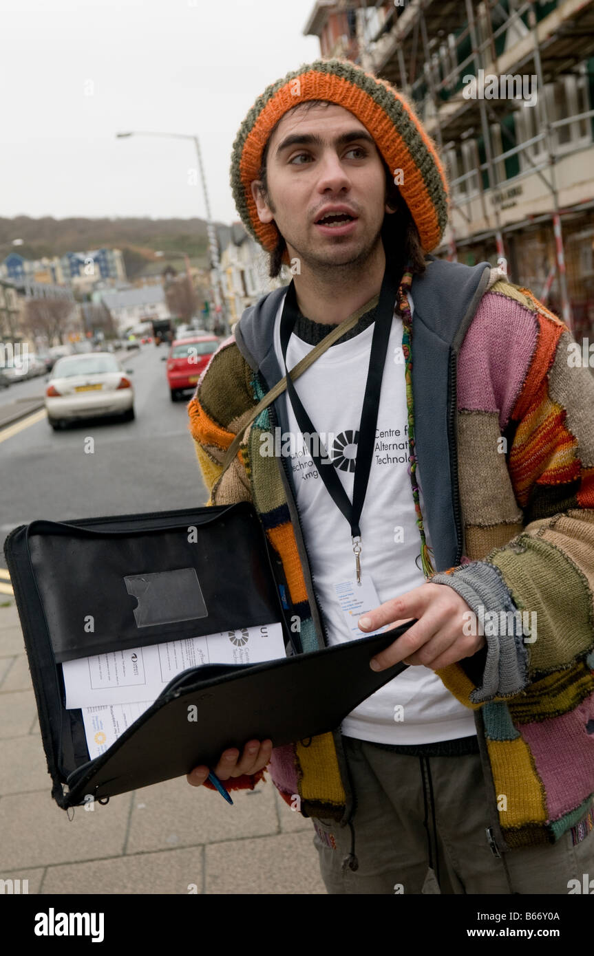 A young man collecting funds for charity a "chugger" on the street in ...