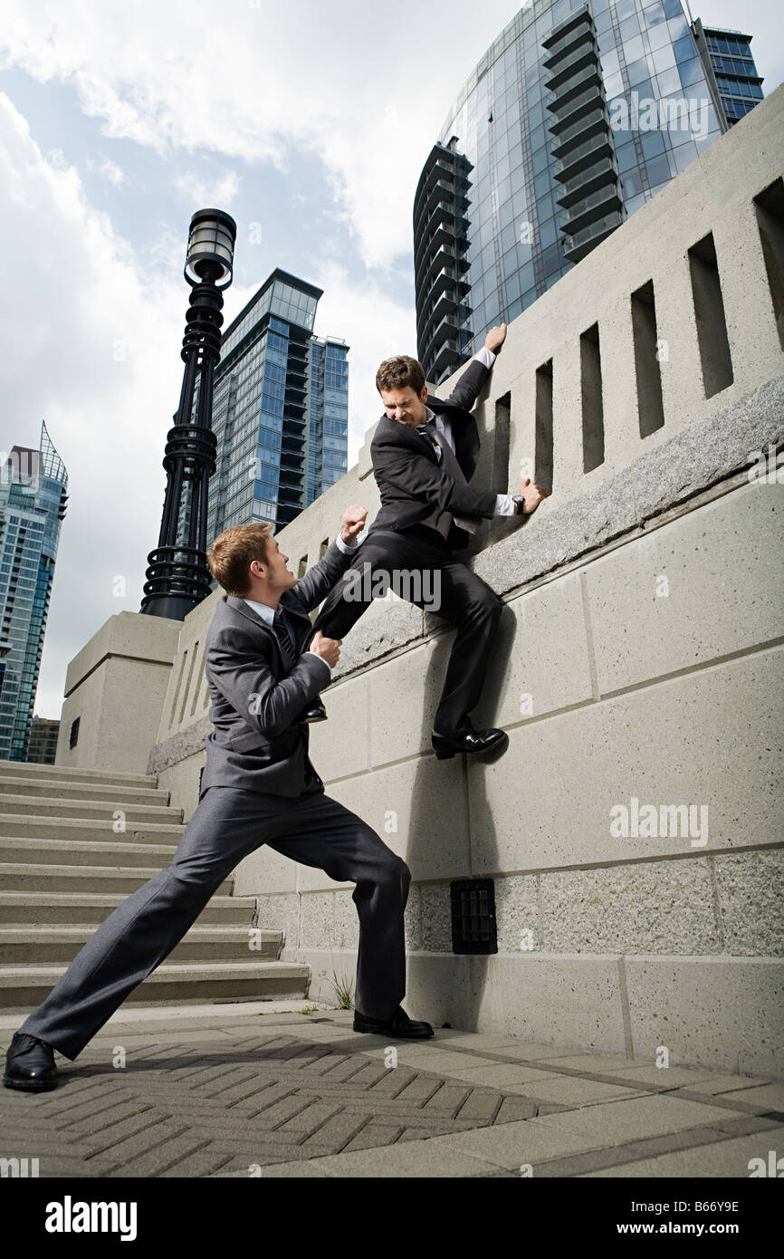 Businessman trying to escape Stock Photo - Alamy
