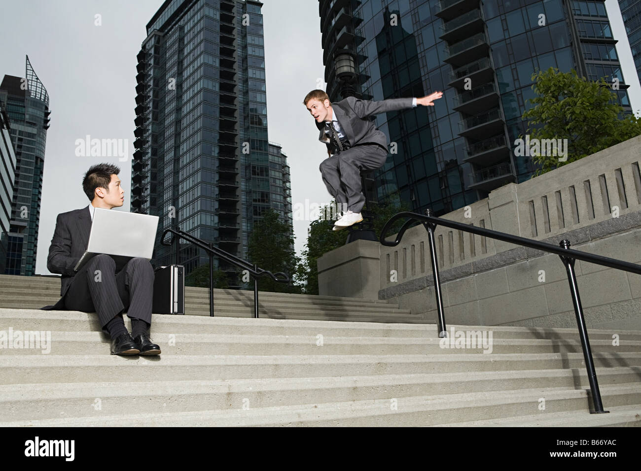 Man suit jumping laptop hi-res stock photography and images - Alamy