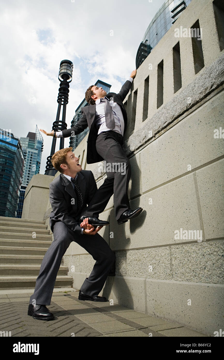 Businessman trying to escape Stock Photo - Alamy
